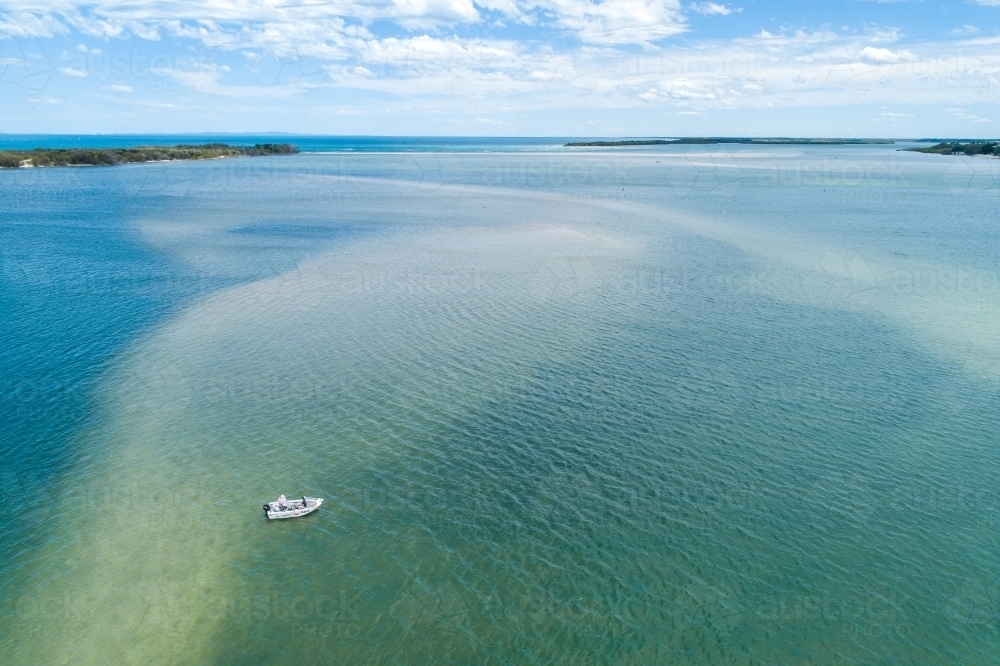 Image of Aerial view of fishing boat on Pumicestone Passage in front of ...