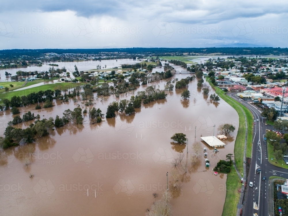 Image of aerial view of flooded park and playing field - Austockphoto