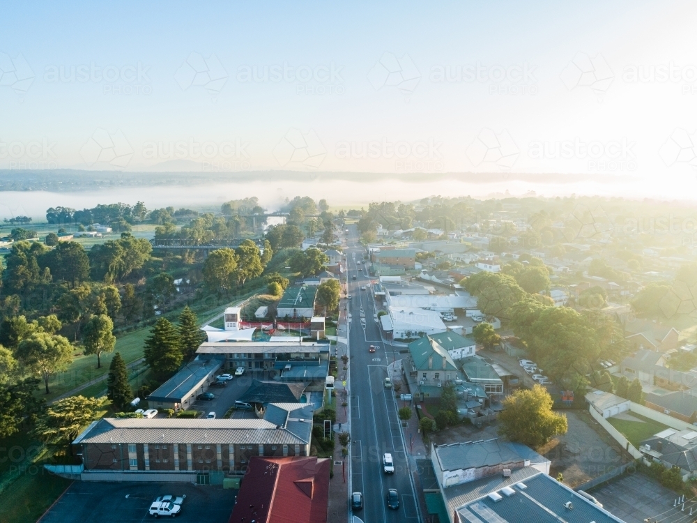 Image of Aerial view of fog surrounding country town in morning light ...