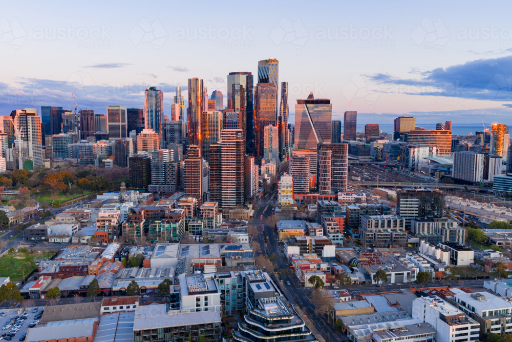 Image of Aerial view of golden evening light shining on highrise ...