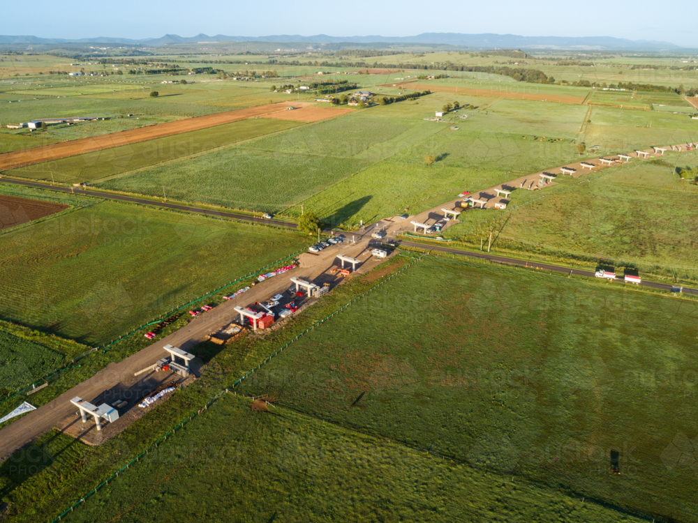 Image of Aerial view of green farmland in Singleton with beginnings of ...
