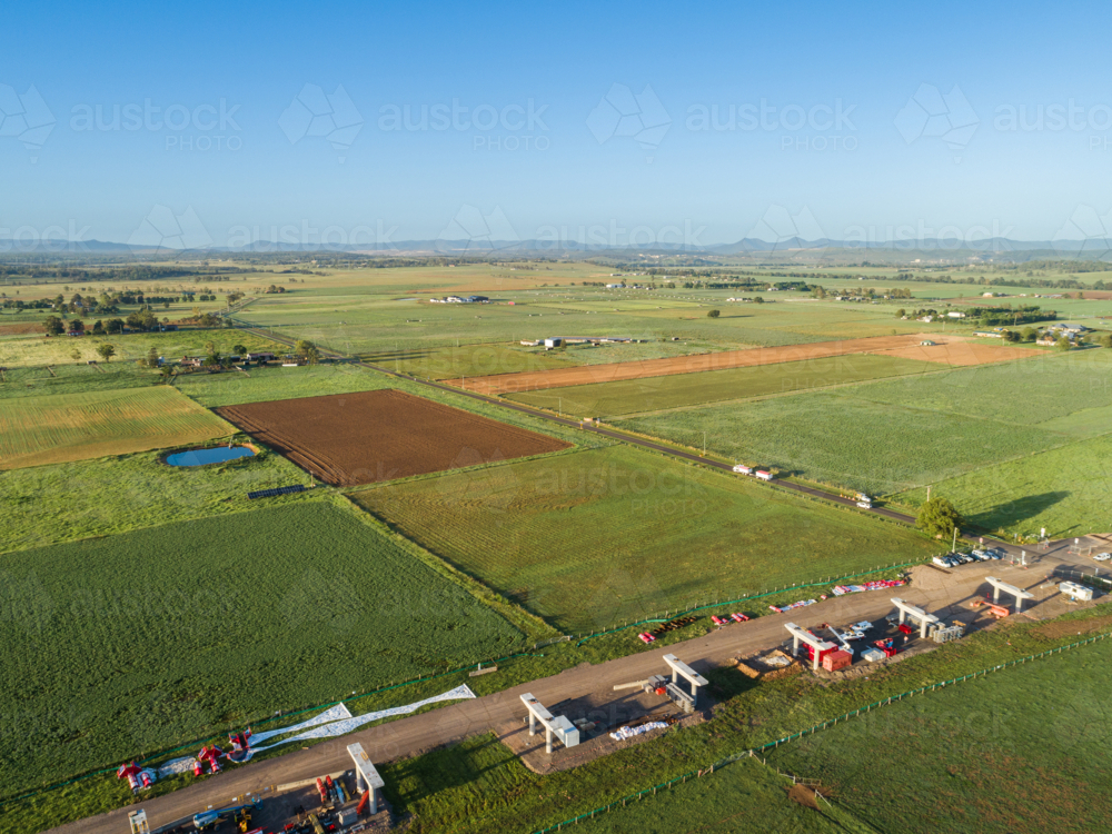 Image of Aerial view of green farmland in Singleton with beginnings of ...