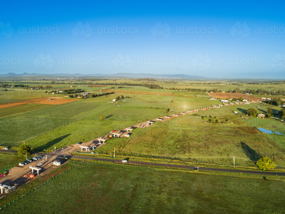 Image of Aerial view of green farmland in Singleton with beginnings of ...