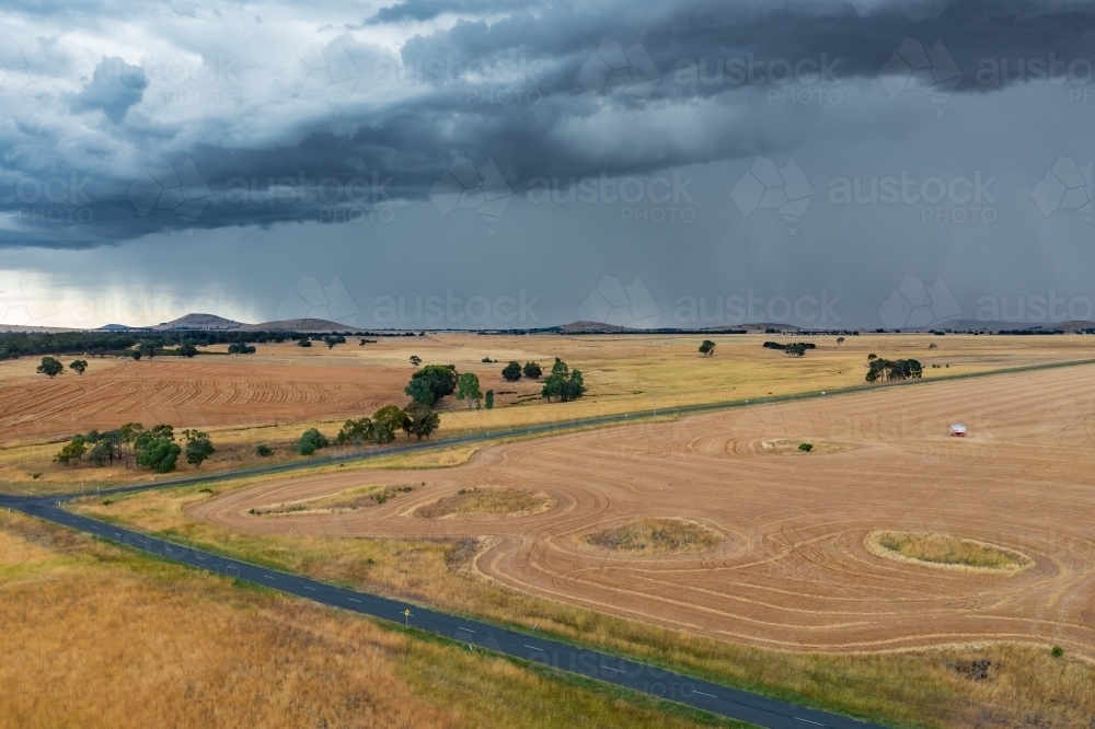 Image of Aerial view of heavy rain falling over country roads and ...