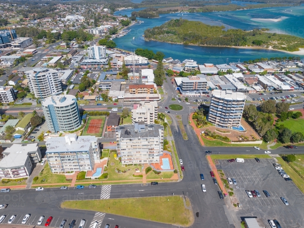 Image of Aerial view of high rise waterfront buildings along side a ...