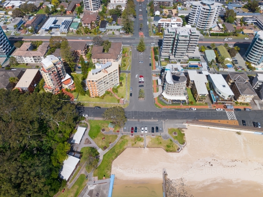 Image of Aerial view of high rise waterfront buildings behind a carpark ...