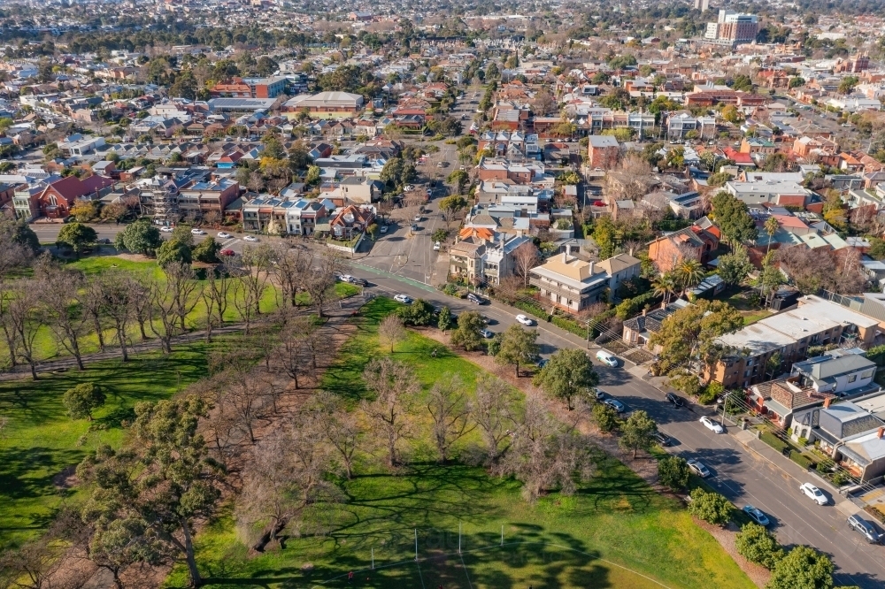 Image of Aerial view of historic buildings around a suburban park ...