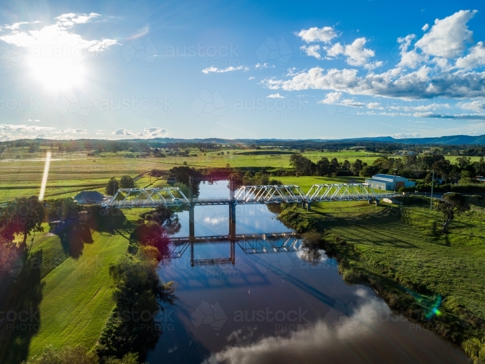 Image of Aerial view of historical timber truss bridge crossing river ...
