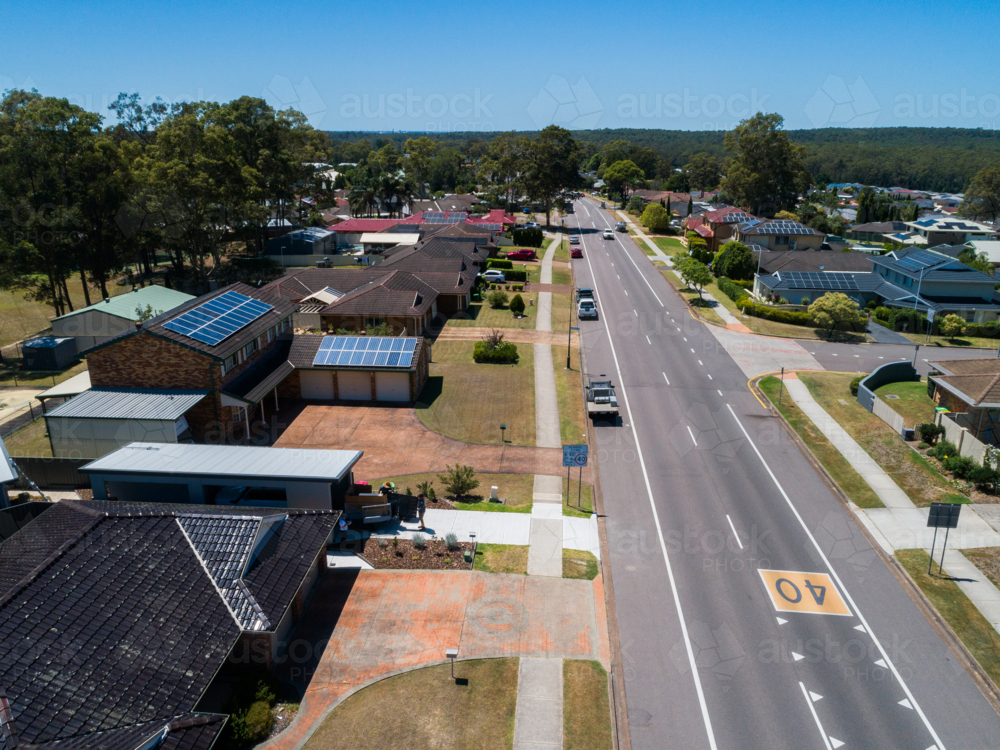 Image of Aerial view of houses along street in Australian suburbia ...