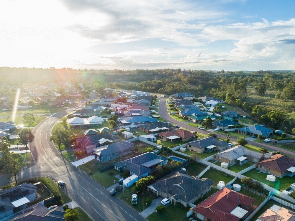 Image of Aerial view of houses and driveways along neighbourhood street ...