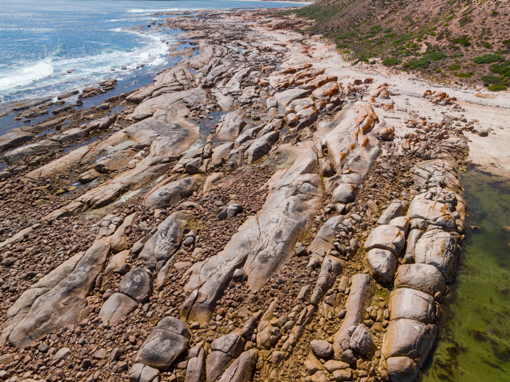 Image of Aerial view of layers of rock and granite along a remote ...