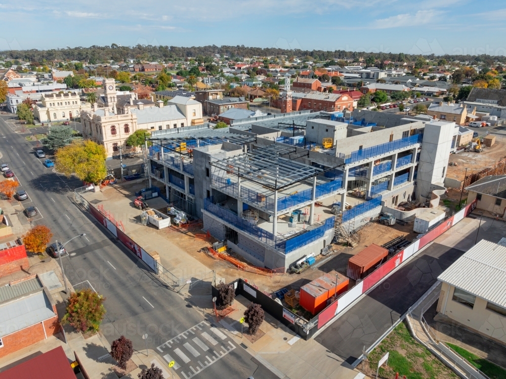 Image of Aerial view of multi level construction site alongside ...