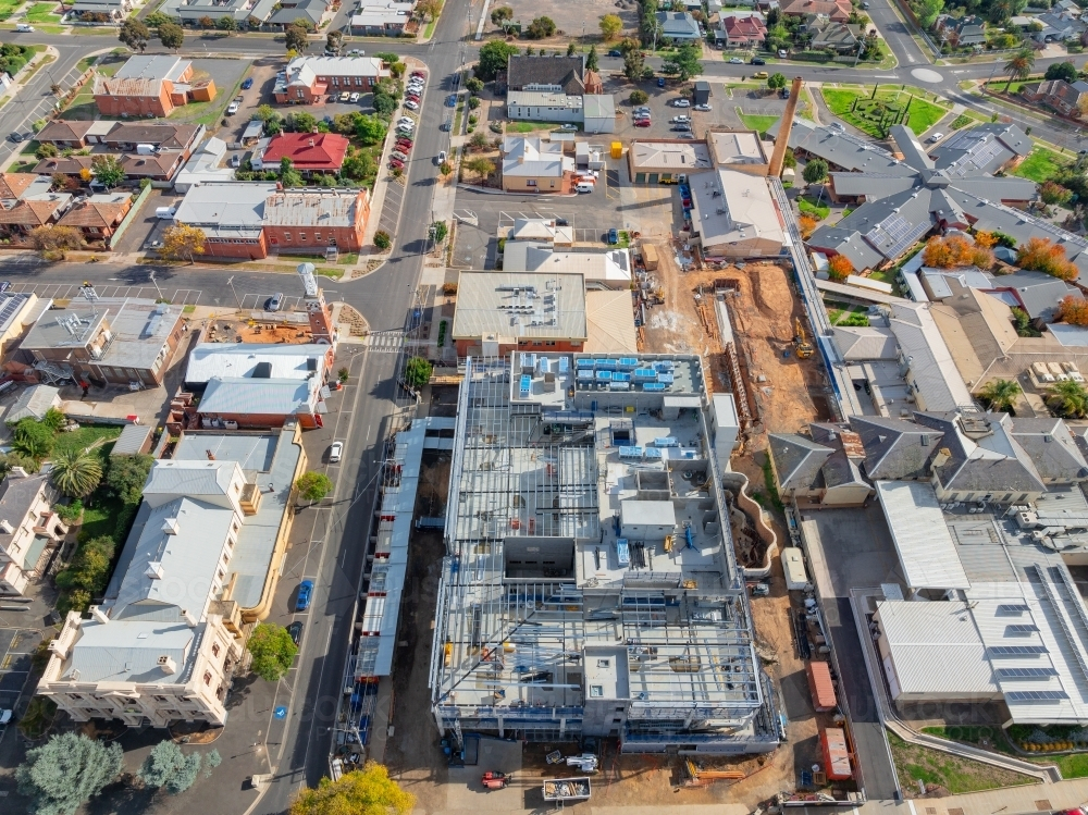 Image of Aerial view of multi level construction site alongside ...