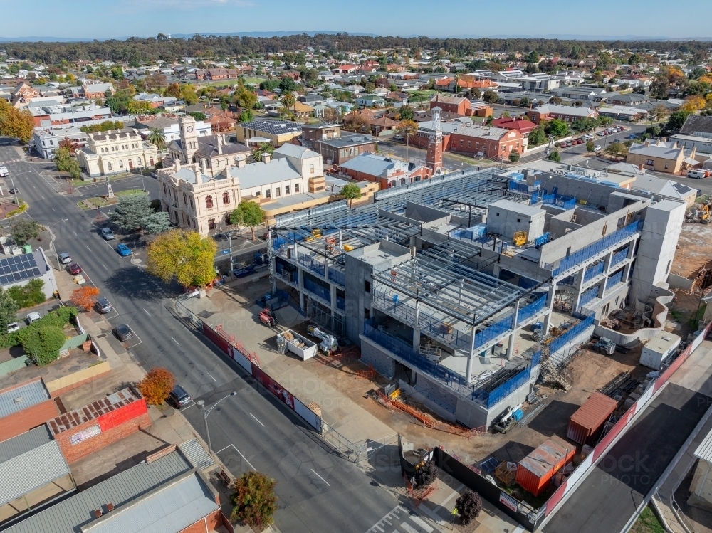 Image of Aerial view of multi level construction site alongside ...