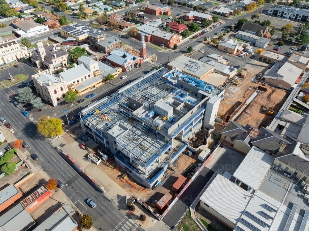 Image of Aerial view of multi level construction site alongside ...