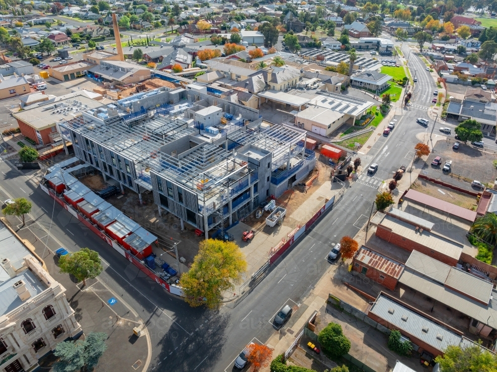 Image of Aerial view of multi level construction site alongside ...