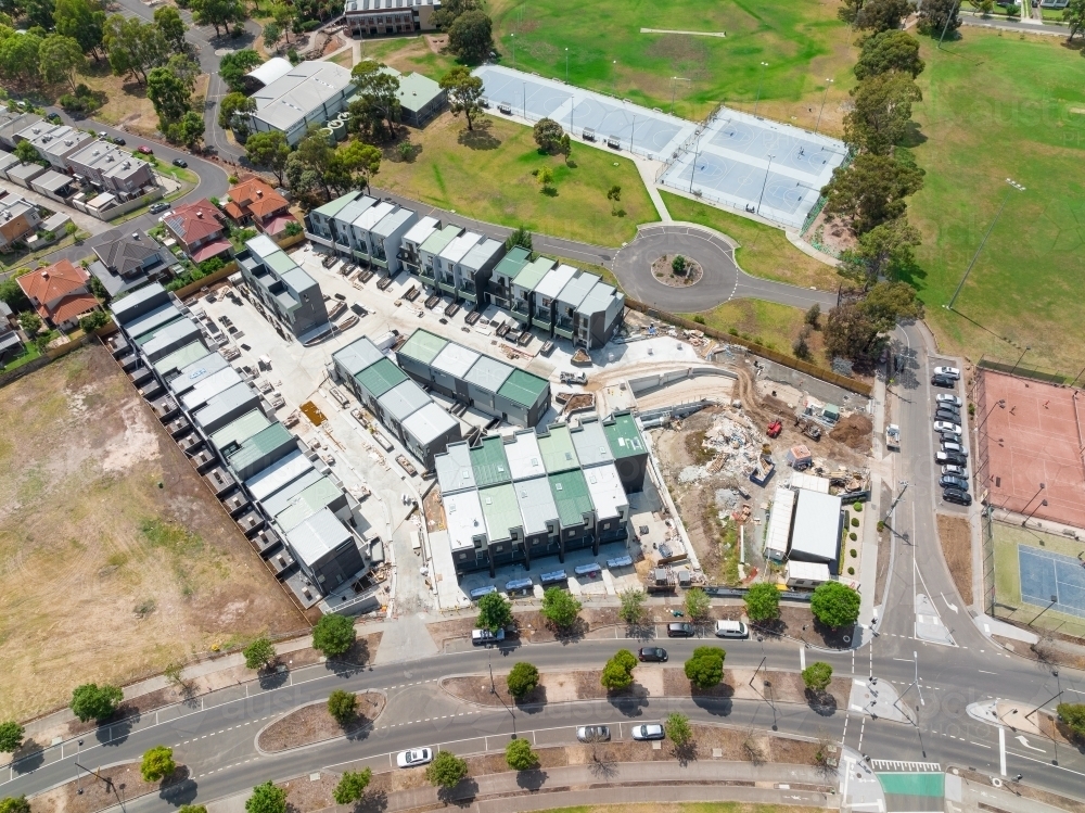 Image of Aerial view of new apartment blocks next to sporting amenities ...
