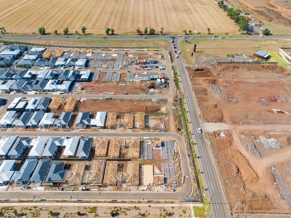 Image of Aerial view of new houses under construction in an urban ...