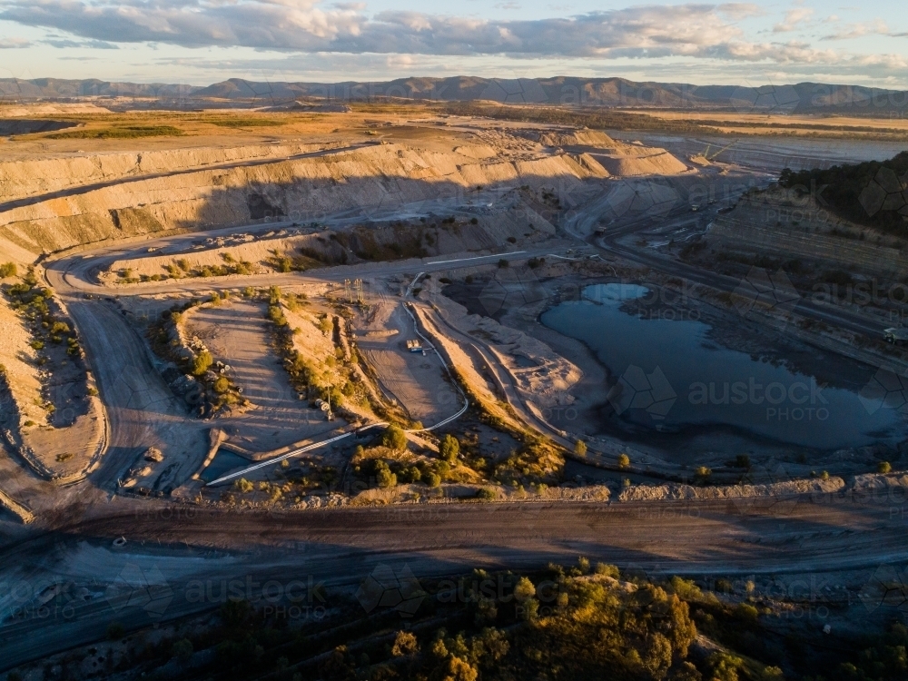 Image of Aerial view of open cut coal mine with water near Singleton ...