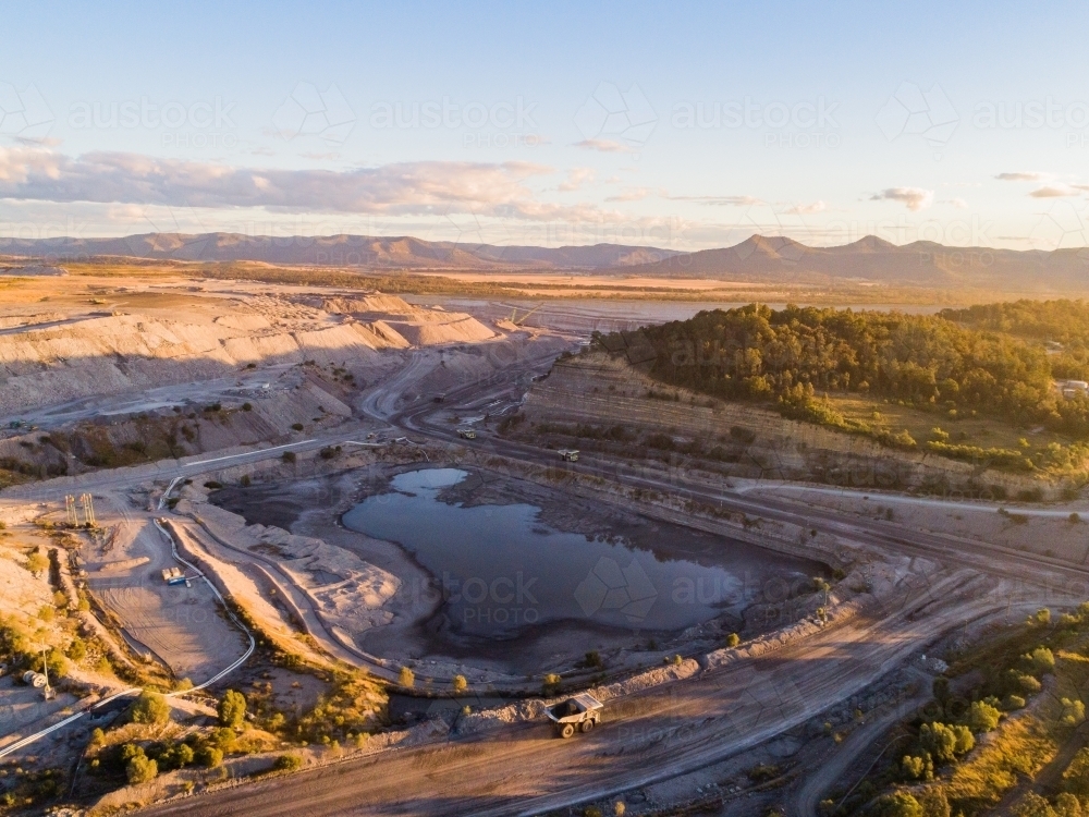Image of Aerial view of open cut coal mine with water near Singleton ...