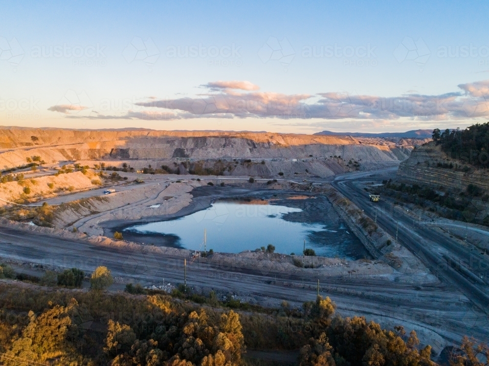 Image of Aerial view of open cut coal mine with water near Singleton ...