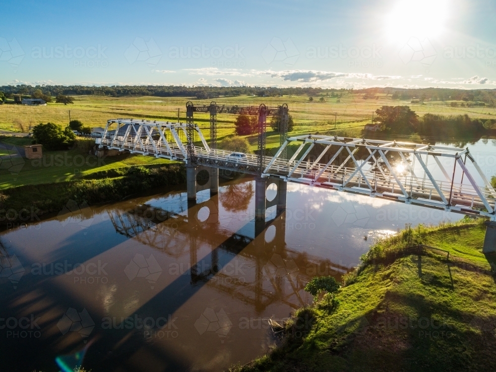 Image of Aerial view of Paterson River and heritage listed bridge with ...