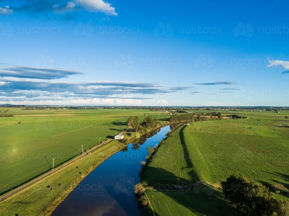 Image of Aerial view of Paterson River winding through green farmland ...