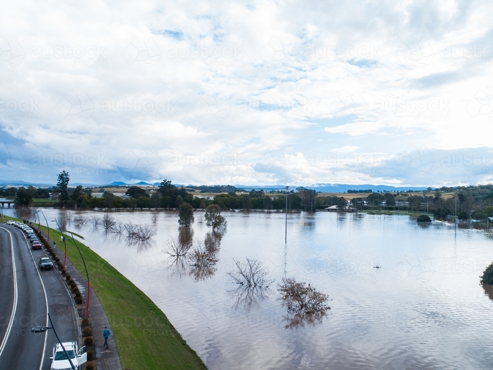 Image of Aerial view of playing field underwater during flood in ...