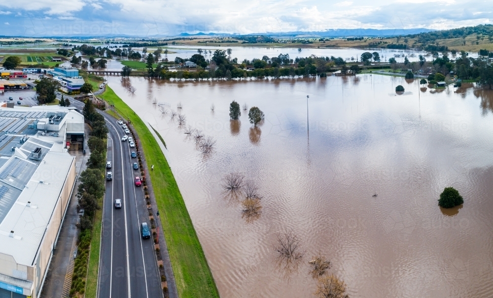 Image of Aerial view of playing field underwater during flood in ...