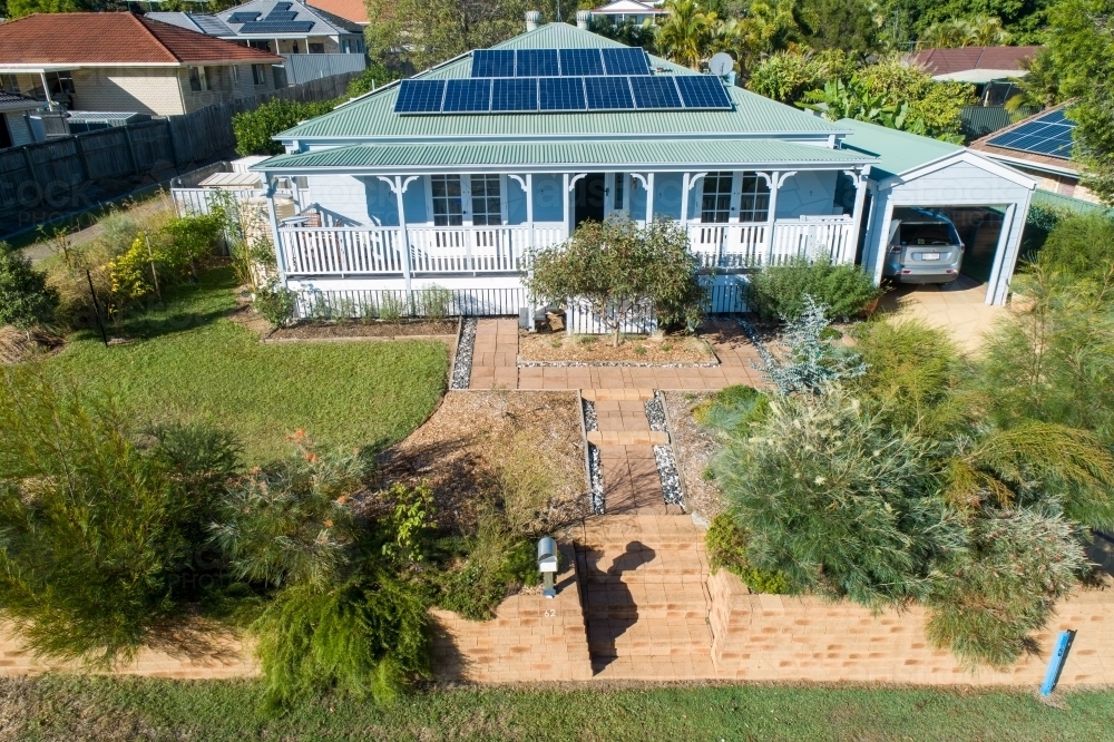 Image of Aerial view of Queenslander style house with solar panels ...