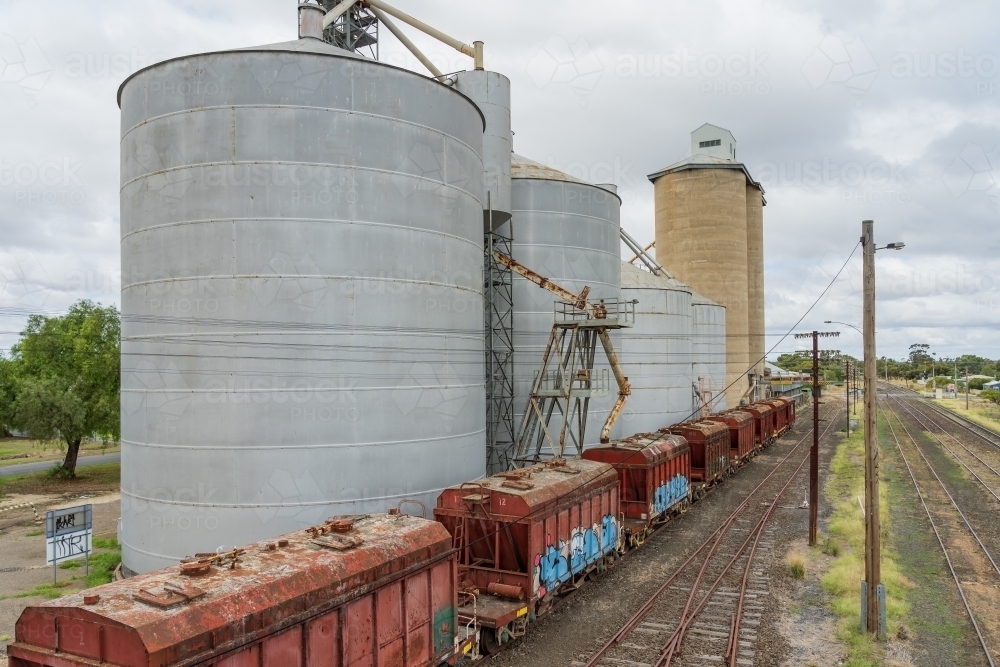 Image of Aerial view of railway carriages alongside grain silos ...