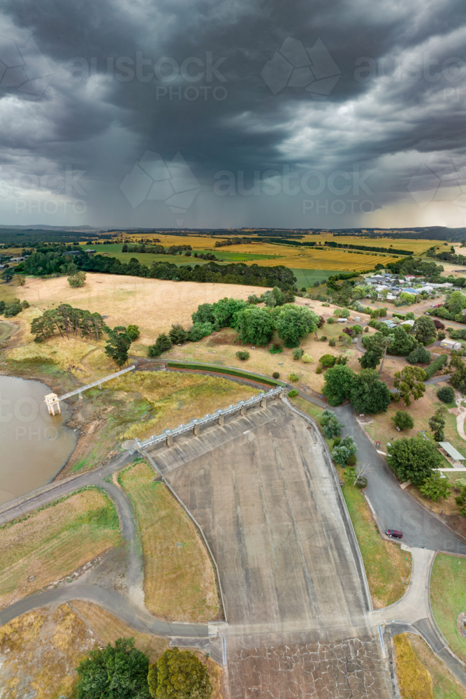 Image of Aerial view of rain falling from a storm cloud over a dry ...