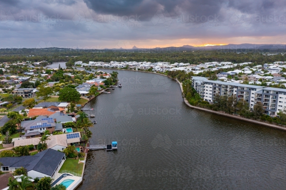 Image of Aerial view of real estate and apartment buildings lining a ...