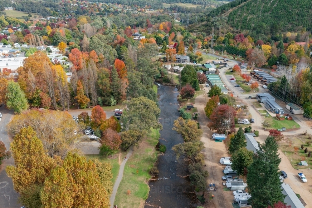 Image of Aerial view of river running through a regional town full of ...