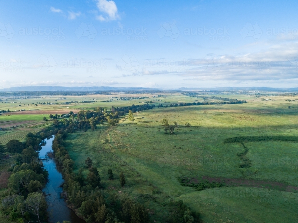 Image of Aerial View of River winding through green countryside in ...
