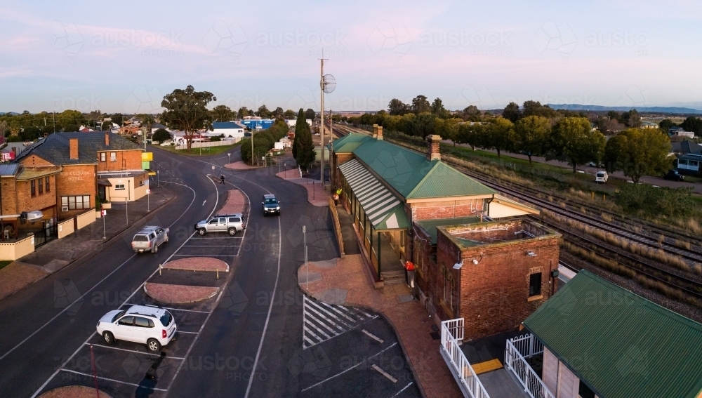Image of Aerial view of road and train station showing public transport ...