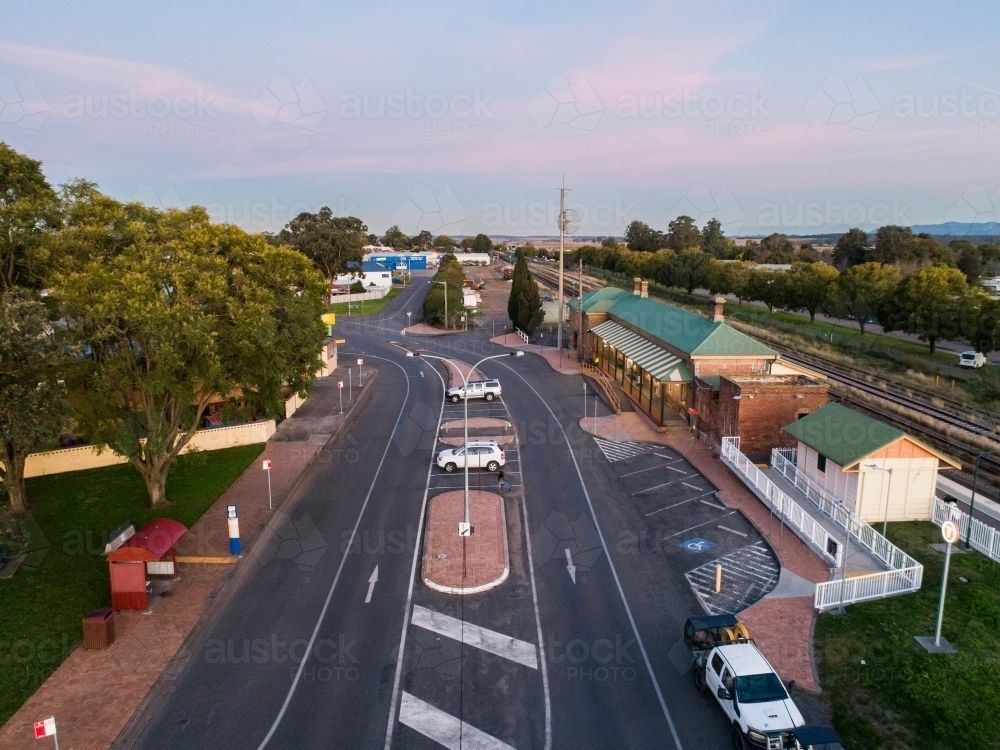 Image of Aerial view of road, bus shelter and train station showing ...