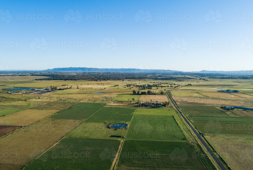 Image of Aerial view of road through farm paddocks near mining town of ...