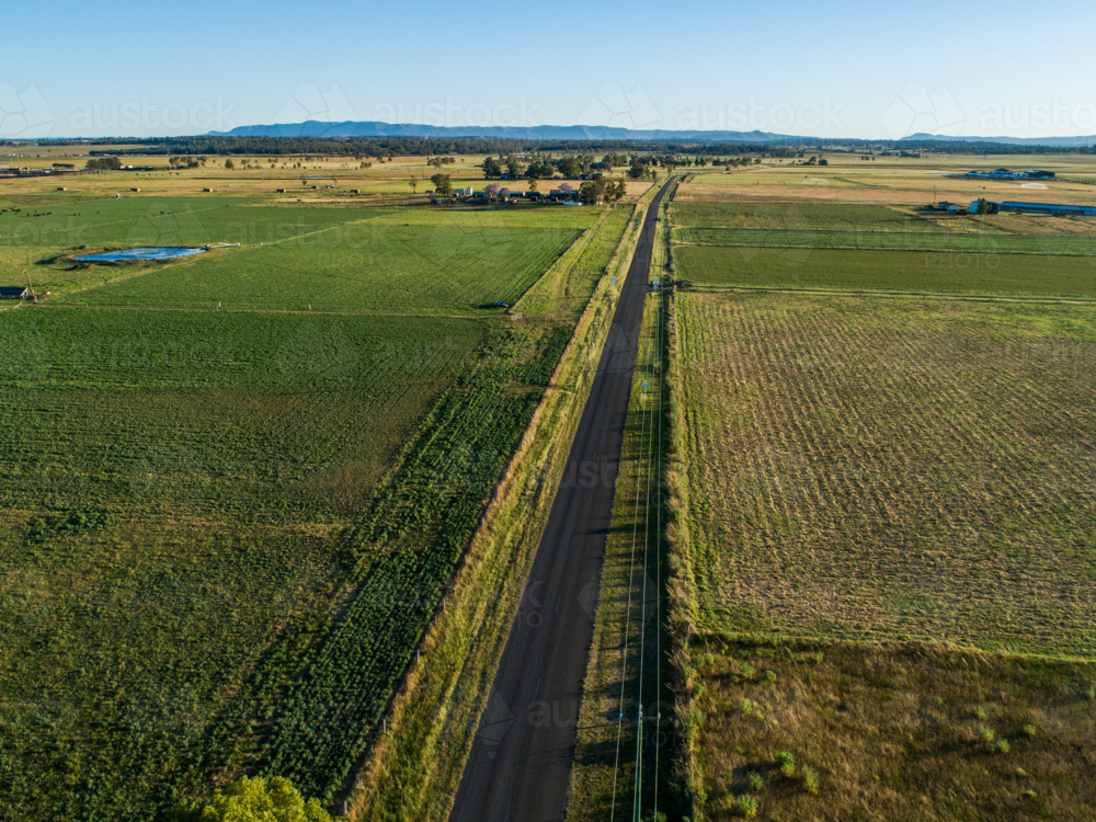 Image of Aerial view of road through farm paddocks near mining town of ...