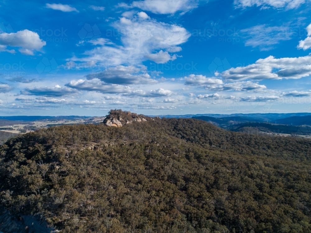 Image of Aerial view of rocky cliff outcrop over Capertee Valley ...