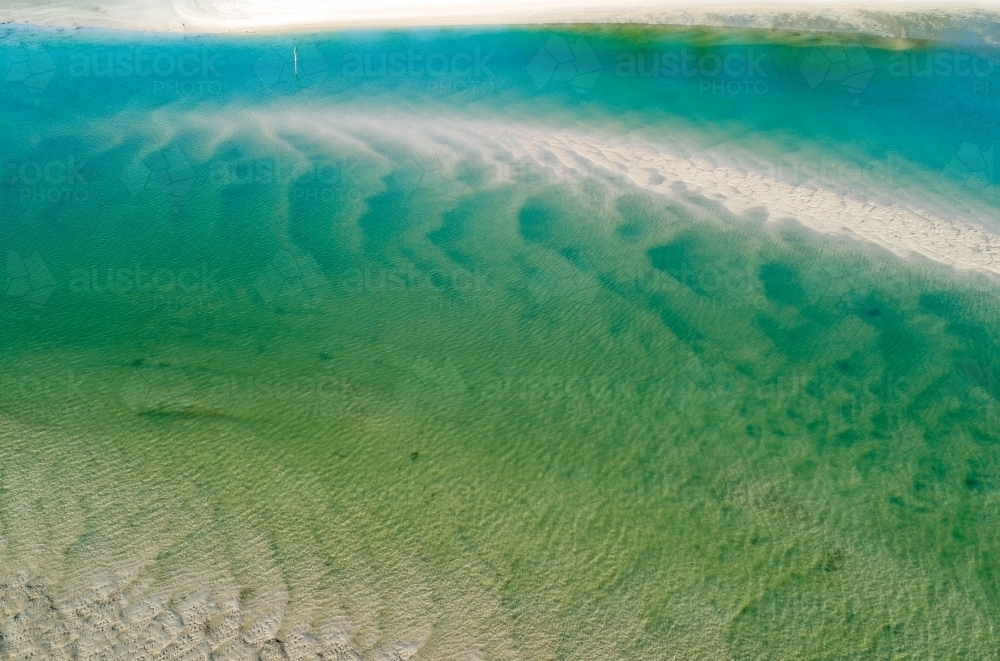 Image of Aerial view of sand ripples and patterns in a shallow creek ...