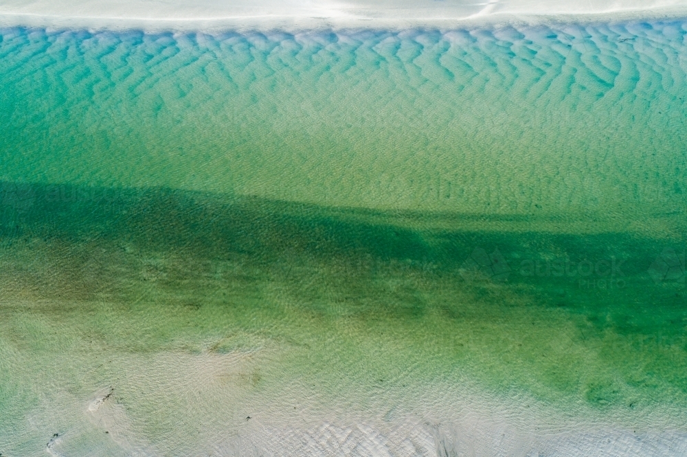 Image of Aerial view of sand ripples and patterns in a shallow creek ...