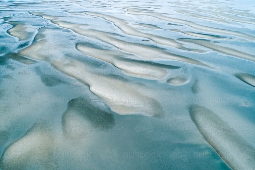 Image of Aerial view of sandbar patterns in shallow blue water ...