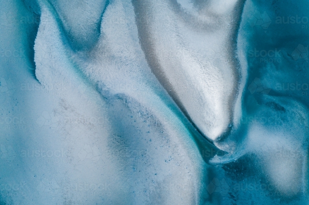 Image of Aerial view of sandbar patterns in shallow blue water ...
