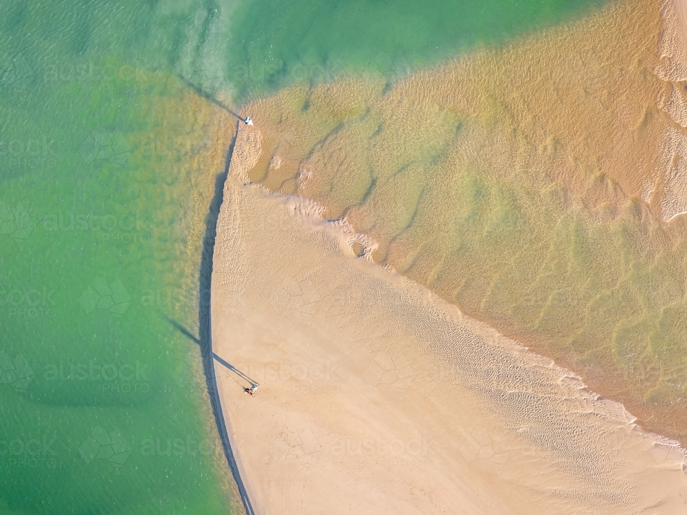 Image of Aerial view of sandbars and waves at the mouth of a tidal ...