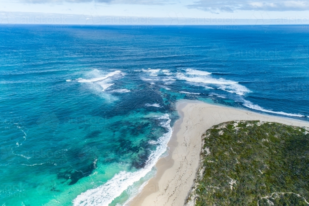 Image of Aerial view of sandy headland and Indian Ocean. - Austockphoto
