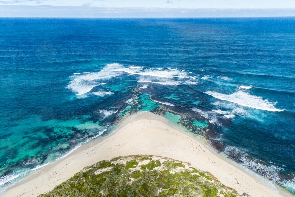Image of Aerial view of sandy headland and Indian Ocean. - Austockphoto
