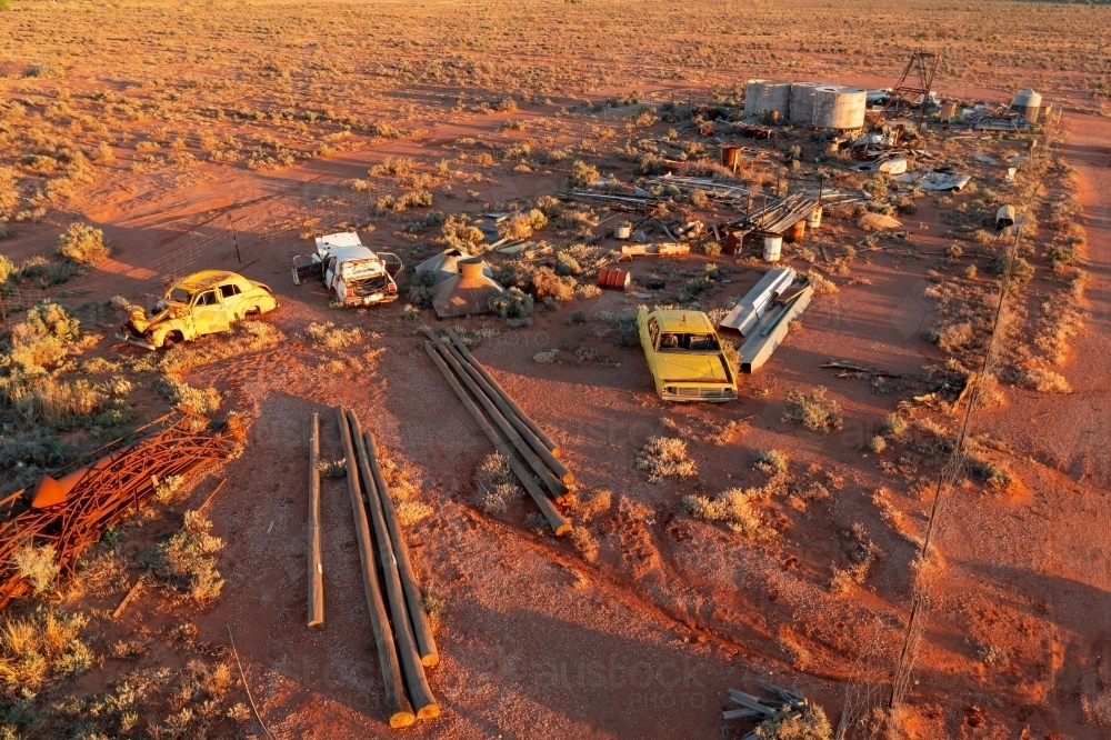Image of Aerial view of scattered car wrecks and building materials in ...