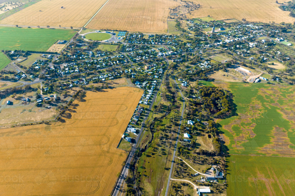 Image of Aerial view of small rural town surrounded by farmland ...