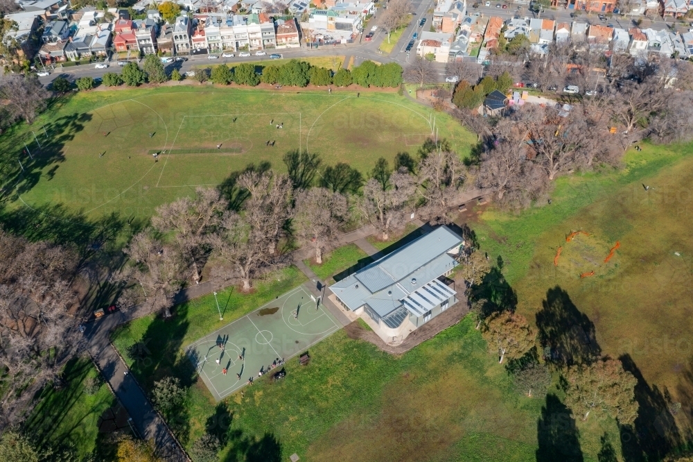 Image of Aerial view of sports ovals and a basketball court in a ...